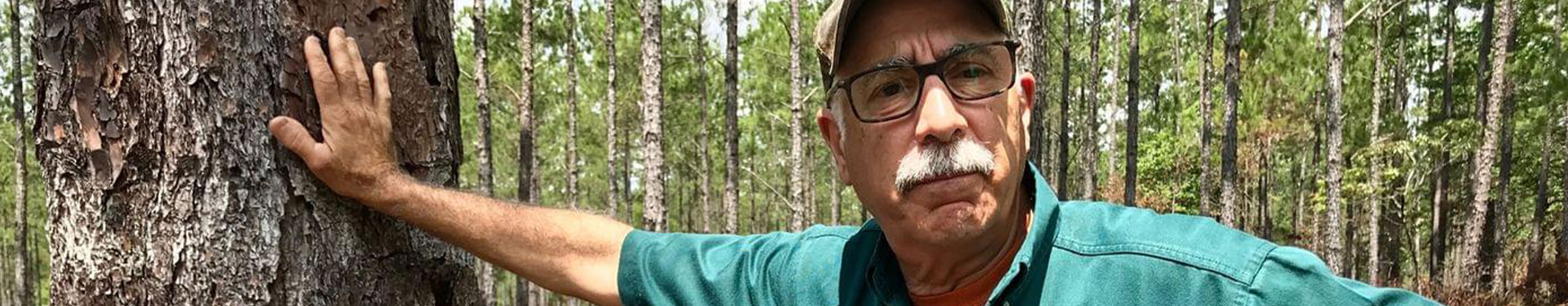 Salem Saloom and a longleaf pine tree | FWS.gov