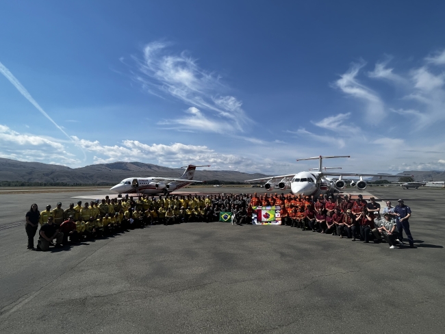 USFWS firefighters and Brazilian fire crews pose for a photo in front ...