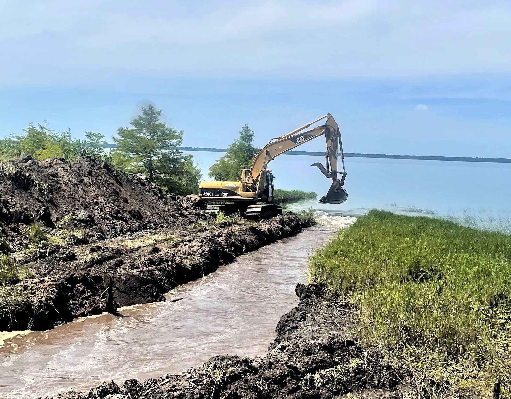Digging a canal near Pocosin Lakes Refuge | FWS.gov
