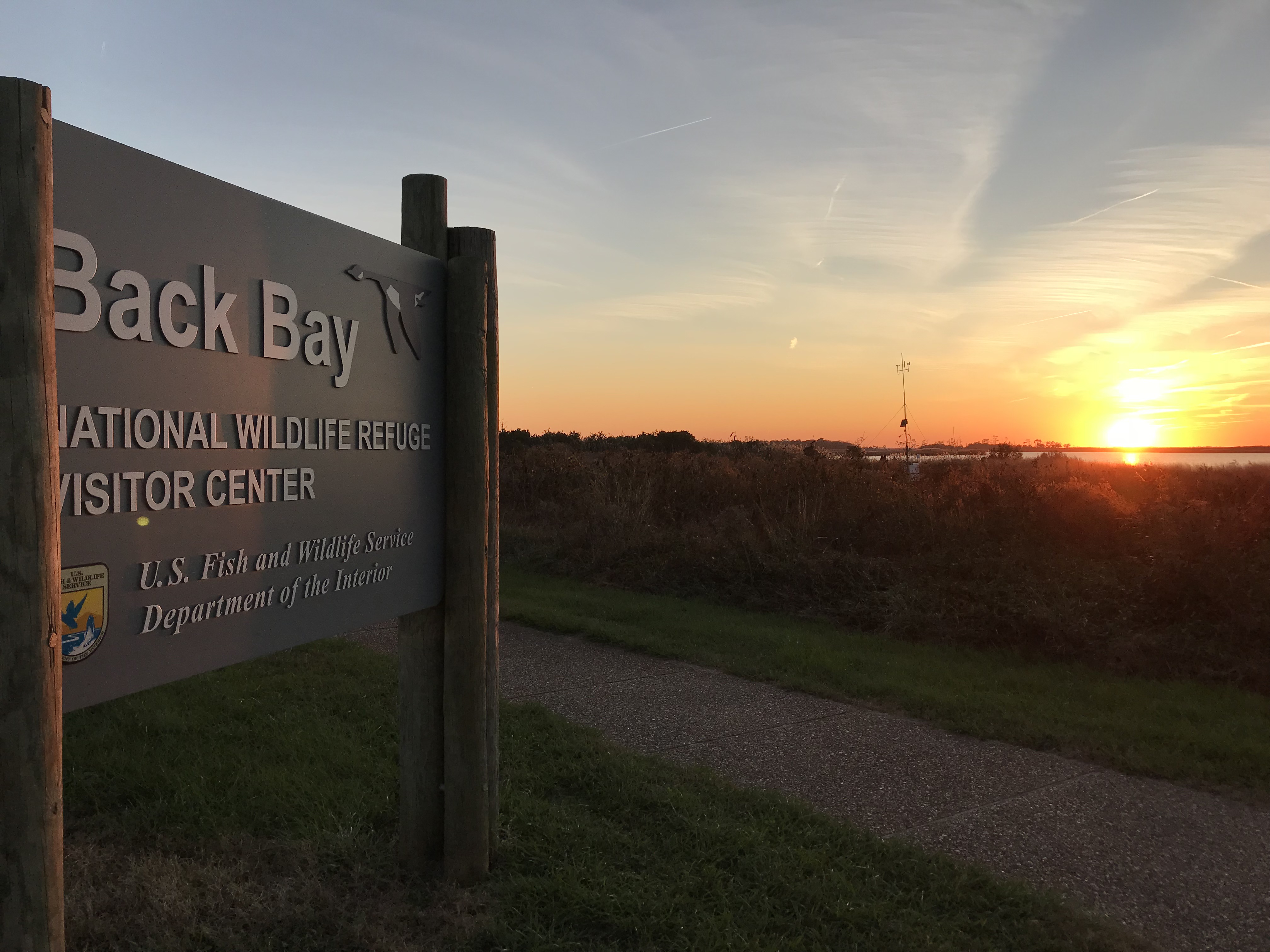 Entrance sign at sunset at Back Bay Refuge | FWS.gov