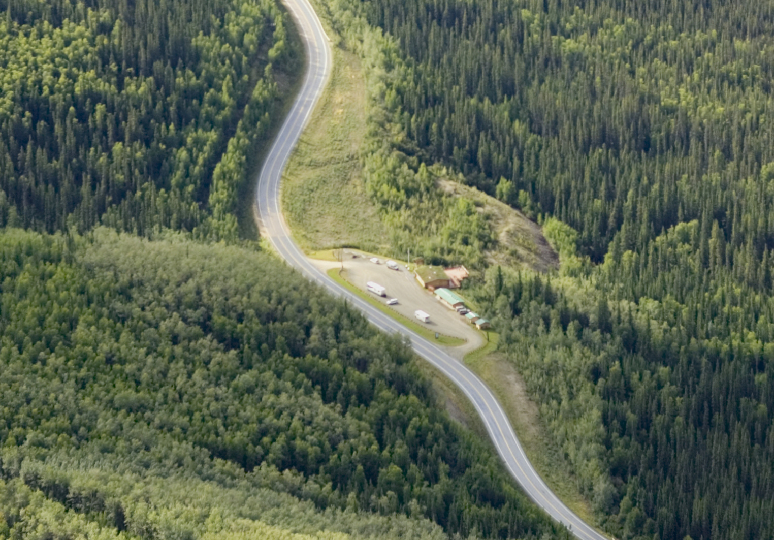 Aerial showing road through mountains in Tetlin National Wildlife ...
