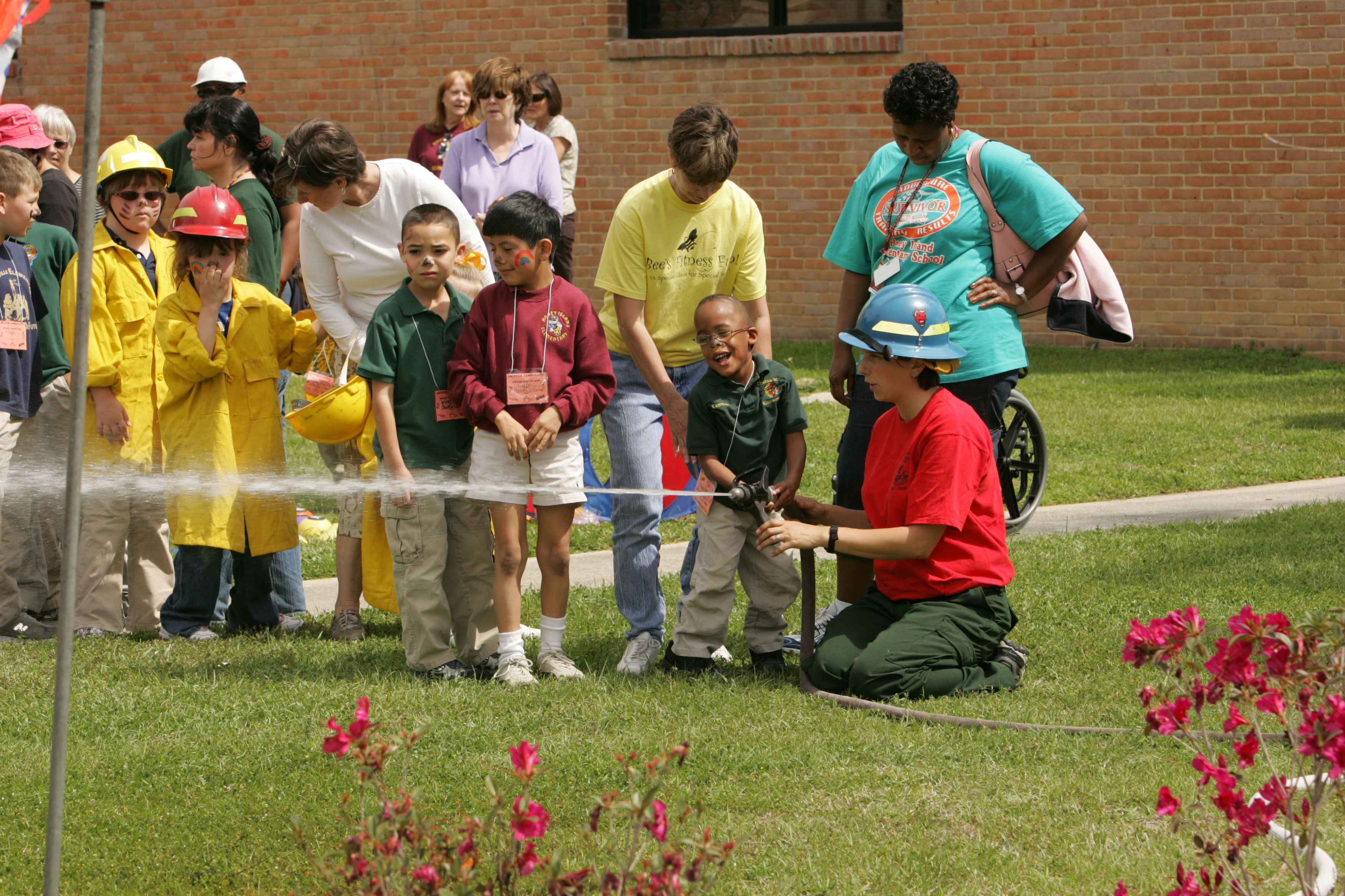 Children line up to experience the thrill of firefighting | FWS.gov