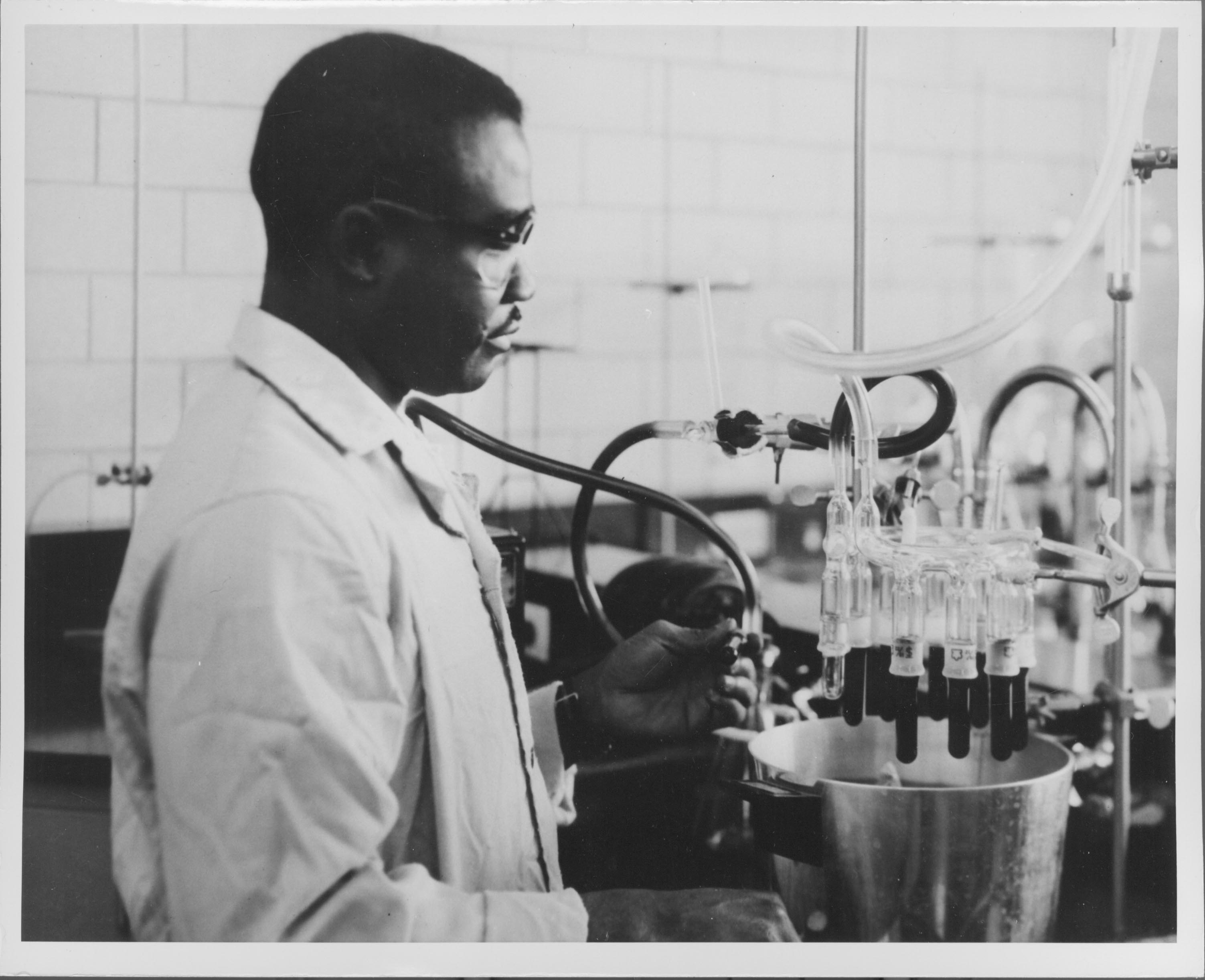 George Bagley using a deep fry pot for pesticide analysis. | FWS.gov