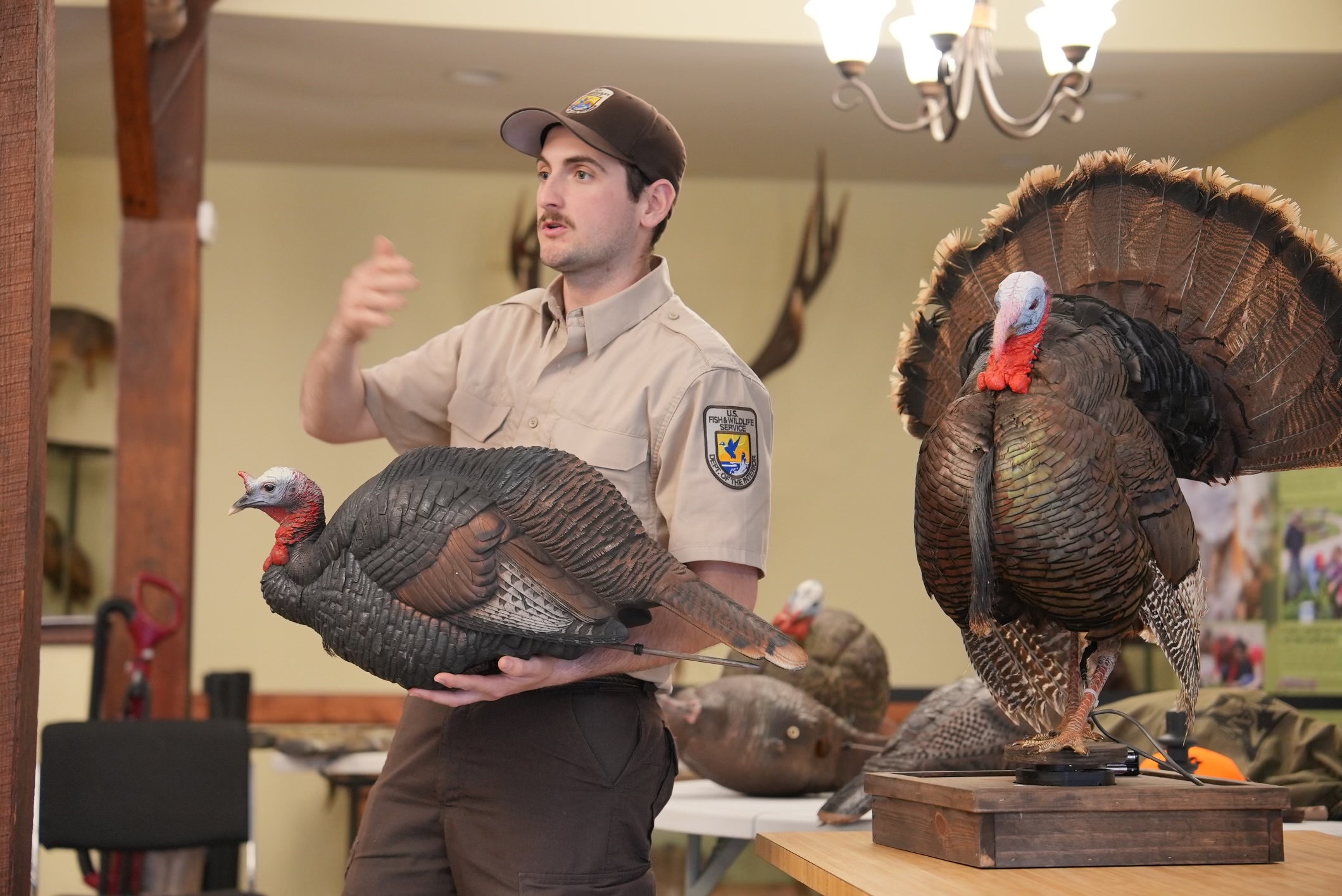 Refuge Employee talks to a group about wild turkey hunting | FWS.gov