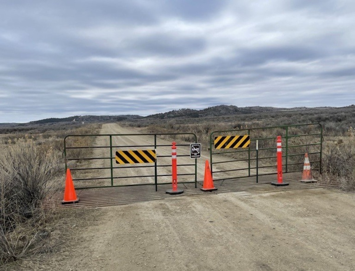 A closed gate barricades the route to the Duvall Bridge on Charles M ...