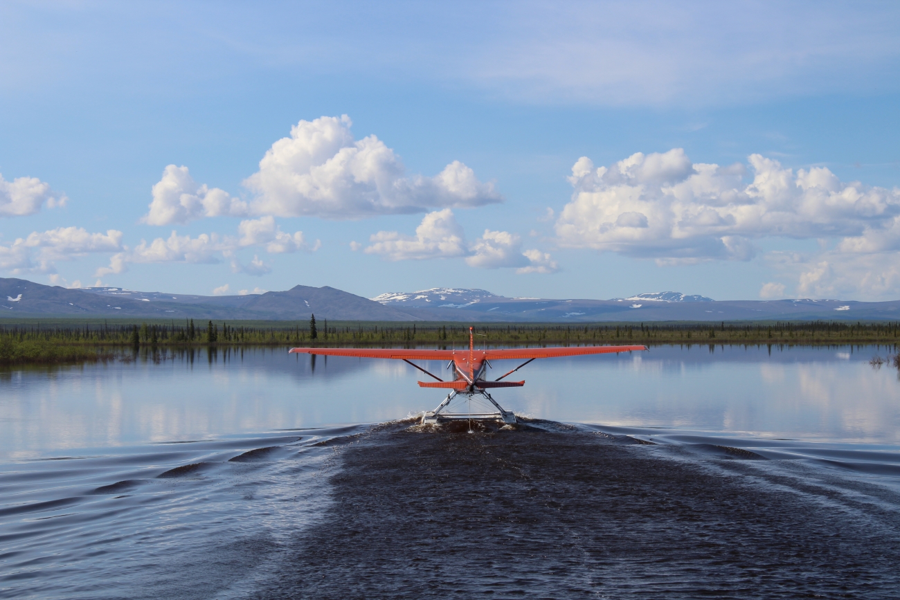 A floatplane takes off from a lake at Kanuti Refuge. | FWS.gov