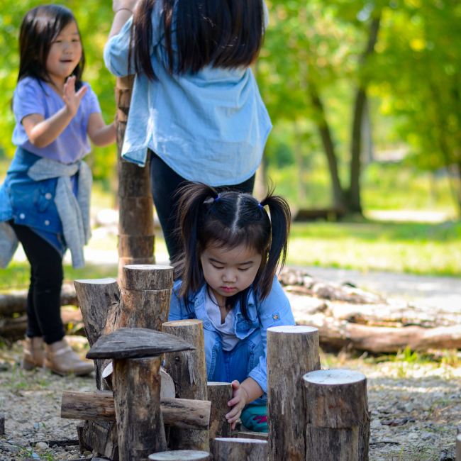 Kids Building with Wood Pieces at a Nature Play Area | FWS.gov